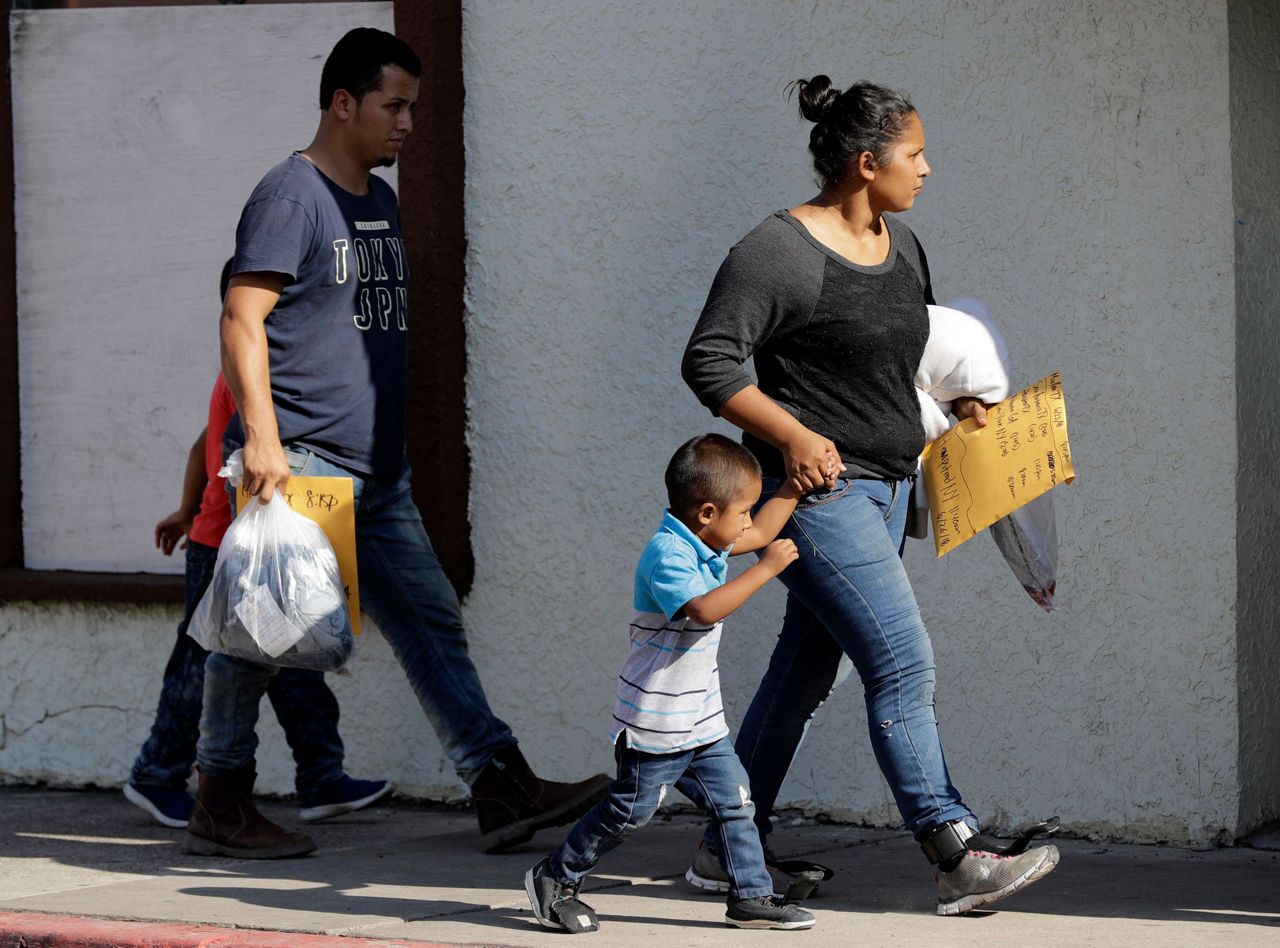 At hub for border crossings, families spread throughout US