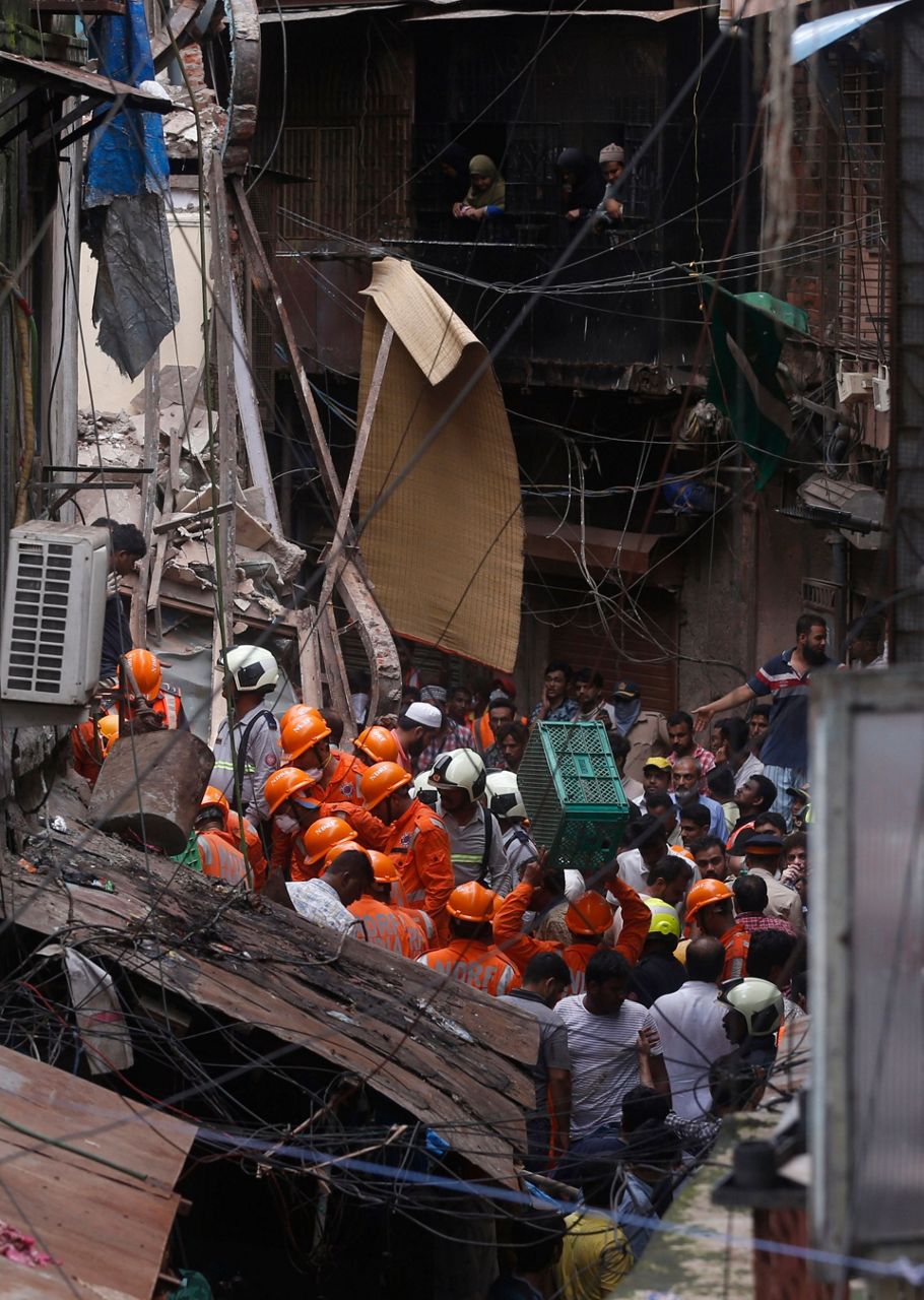Rescuers look for survivors after building collapse in India