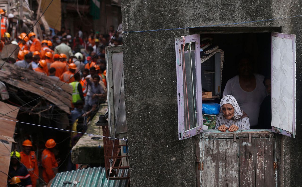 Rescuers look for survivors after building collapse in India