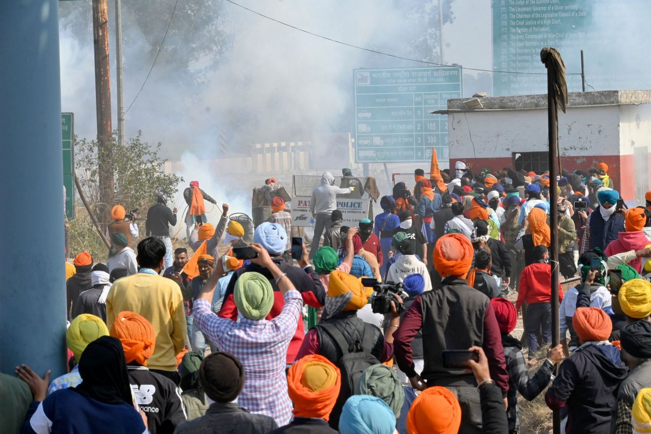 Protesting Indian farmers clash with police for a second day as they ...