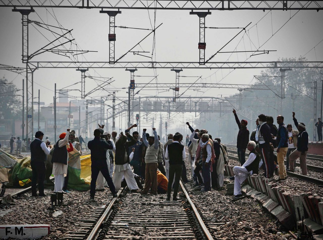 Farmers block trains in northern India to protest new laws