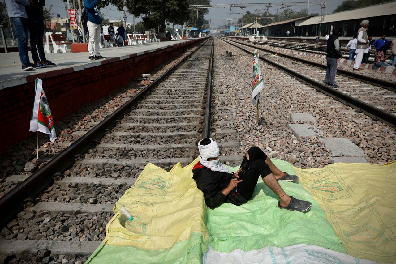 Farmers block trains in northern India to protest new laws