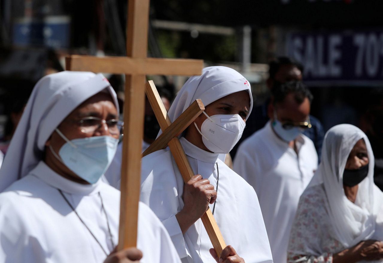 Christians mark Good Friday as holy sites gradually reopen