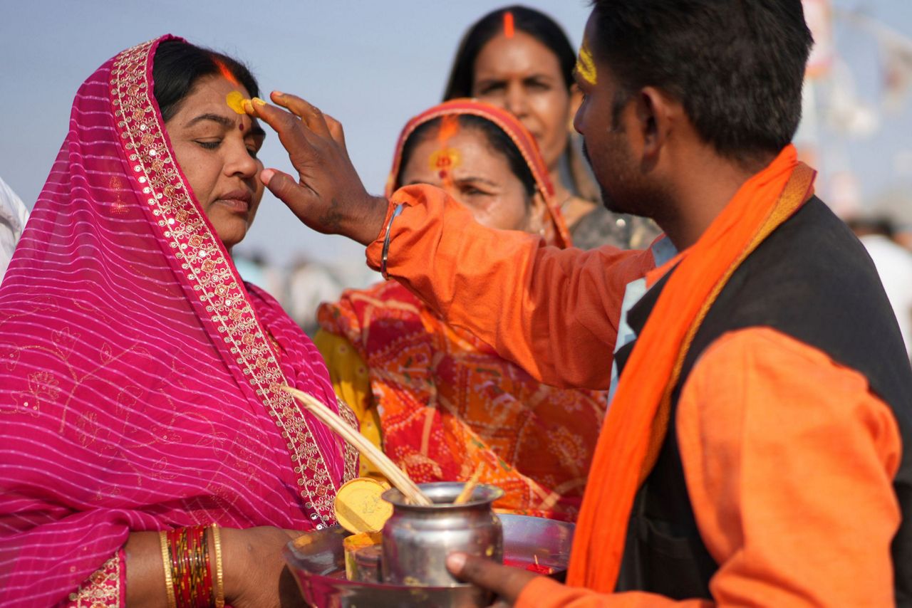 Sacred strokes of color on foreheads are a major display of Hinduism at ...
