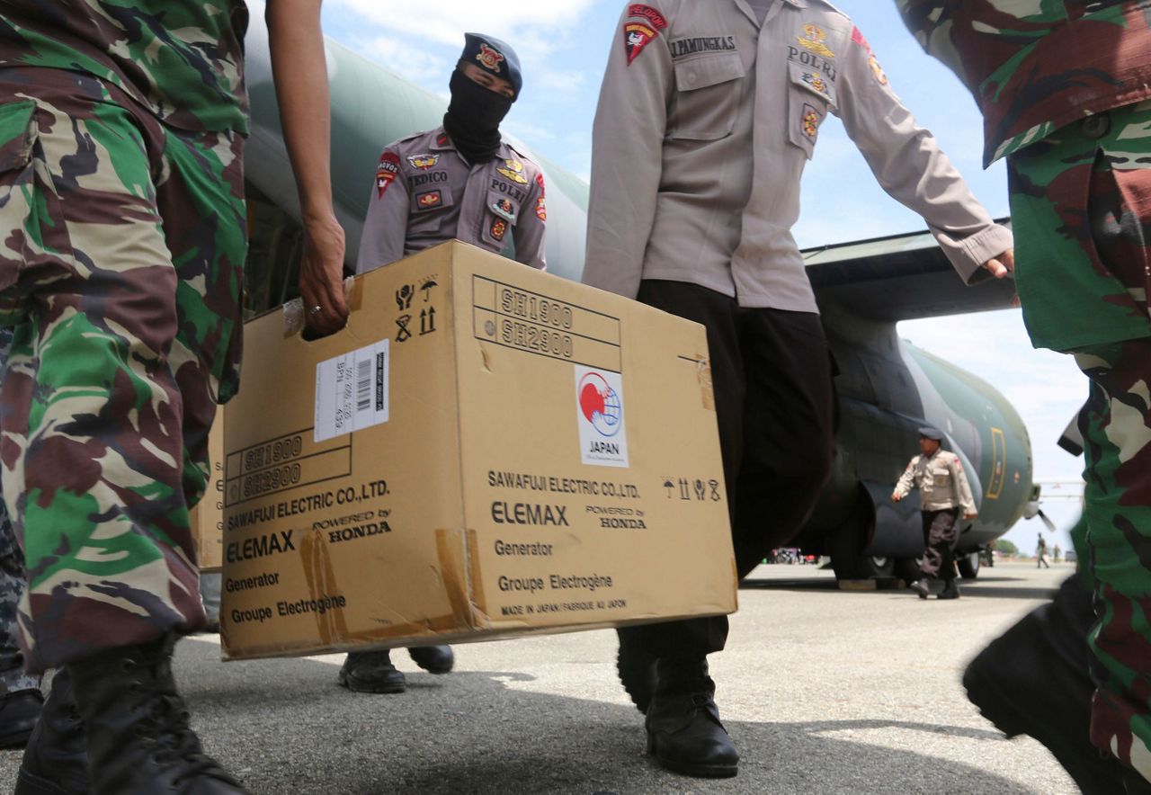 Aid pours in to Indonesian region hit by quake, tsunami