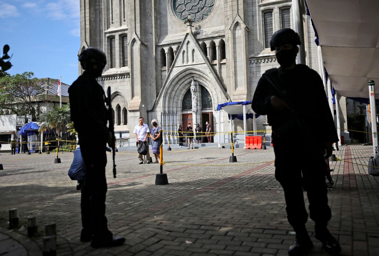 Christians mark Good Friday as holy sites gradually reopen