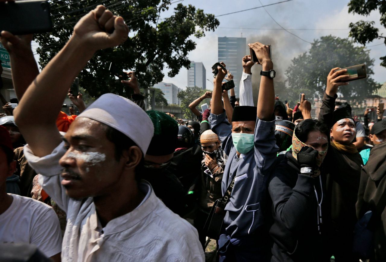 The Latest: Social media blocked due to Indonesia protests