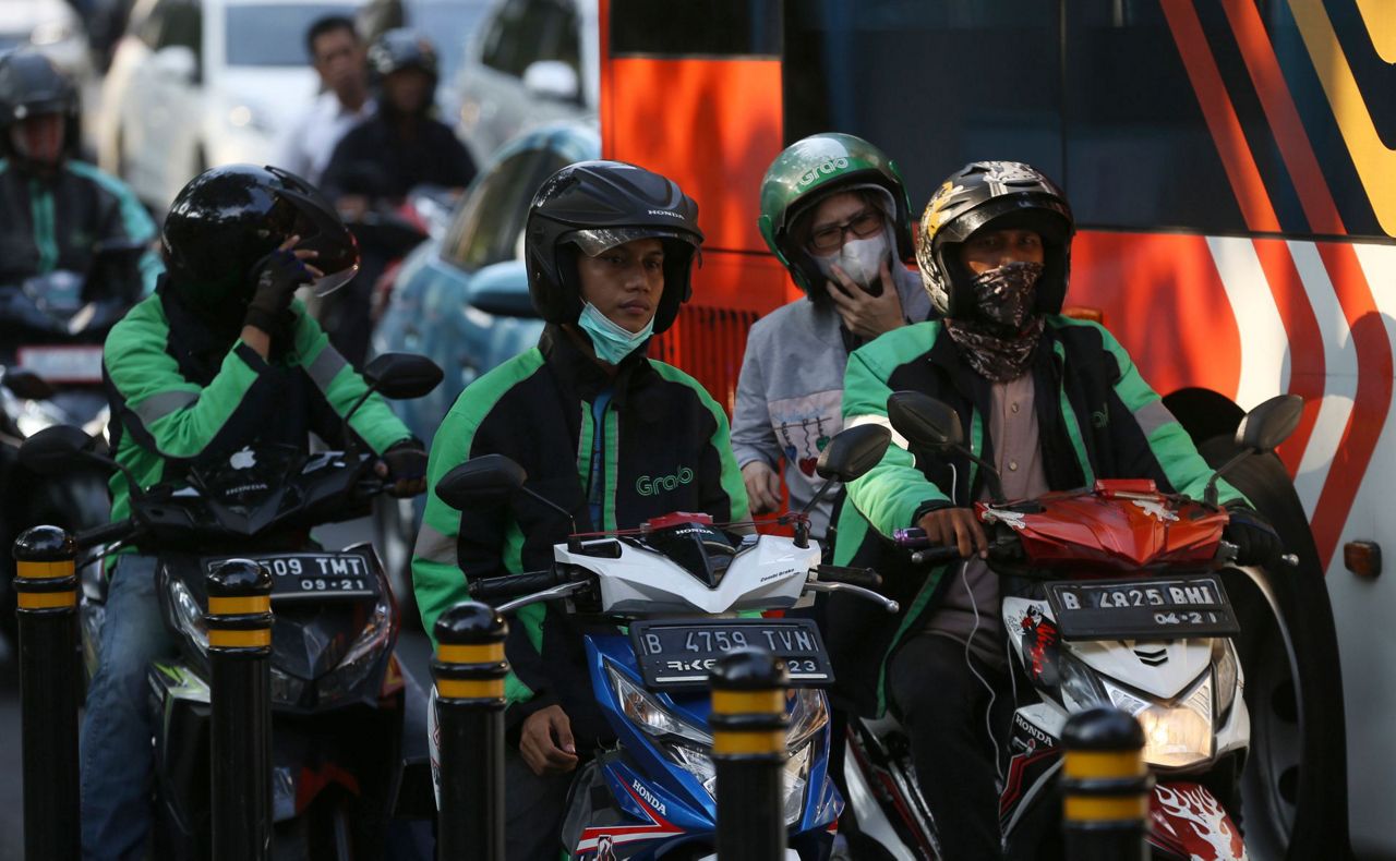 Softbank, ride hailing app Grab investing $2B in Indonesia