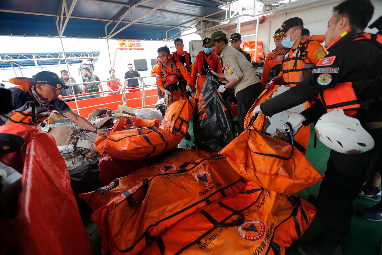 Indonesia plane crash search finds remains, debris at sea