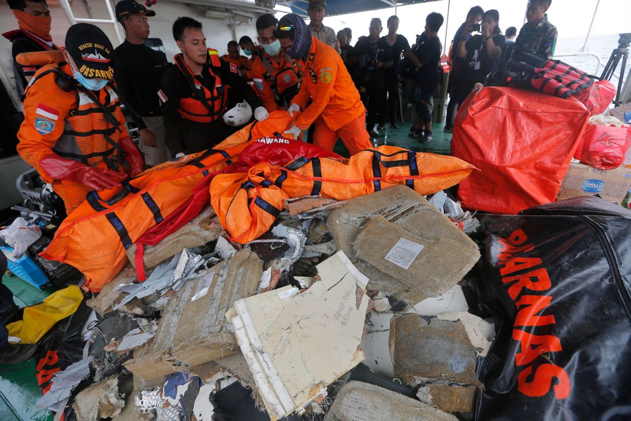 Indonesia plane crash search finds remains, debris at sea