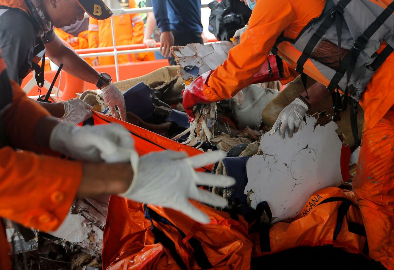 Indonesia plane crash search finds remains, debris at sea