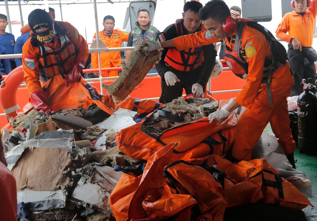 Indonesia plane crash search finds remains, debris at sea