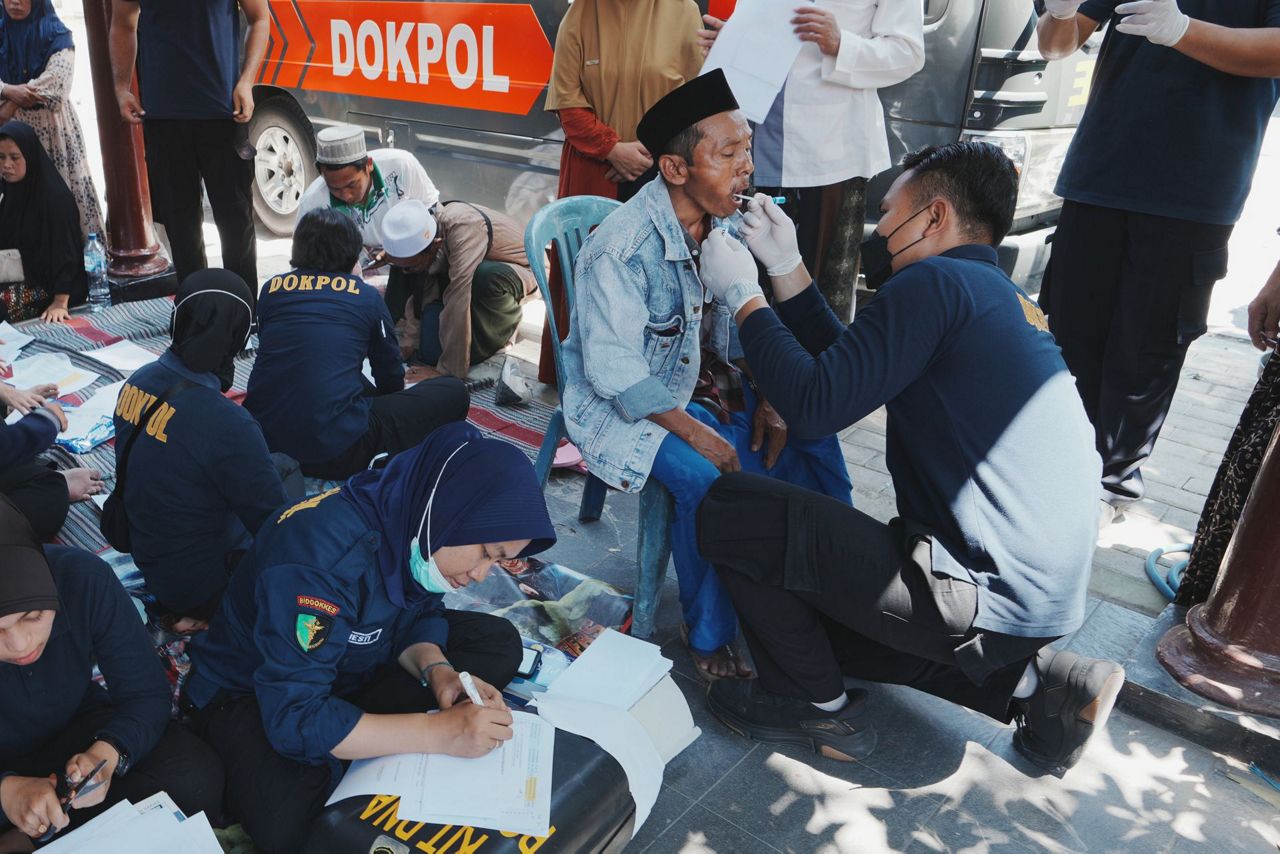 Rescuers chip away debris with hand tools to save those trapped in ...
