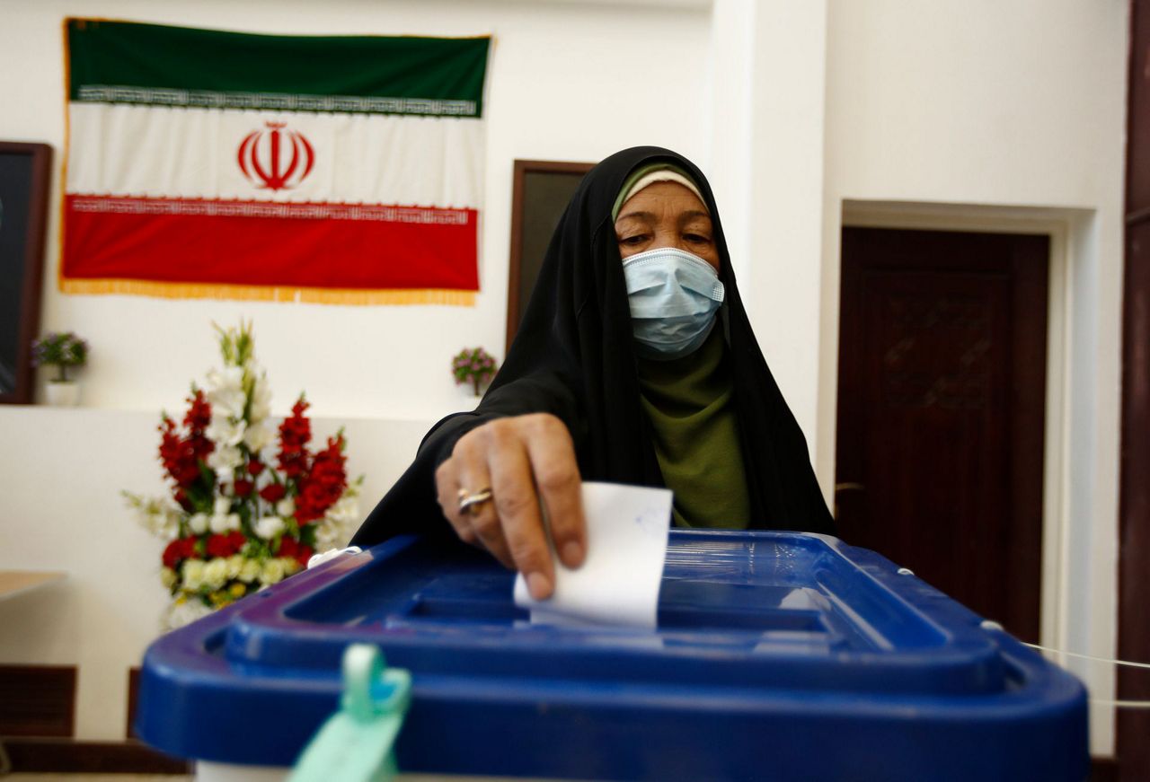 Iran votes in presidential poll tipped in hard-liner's favor