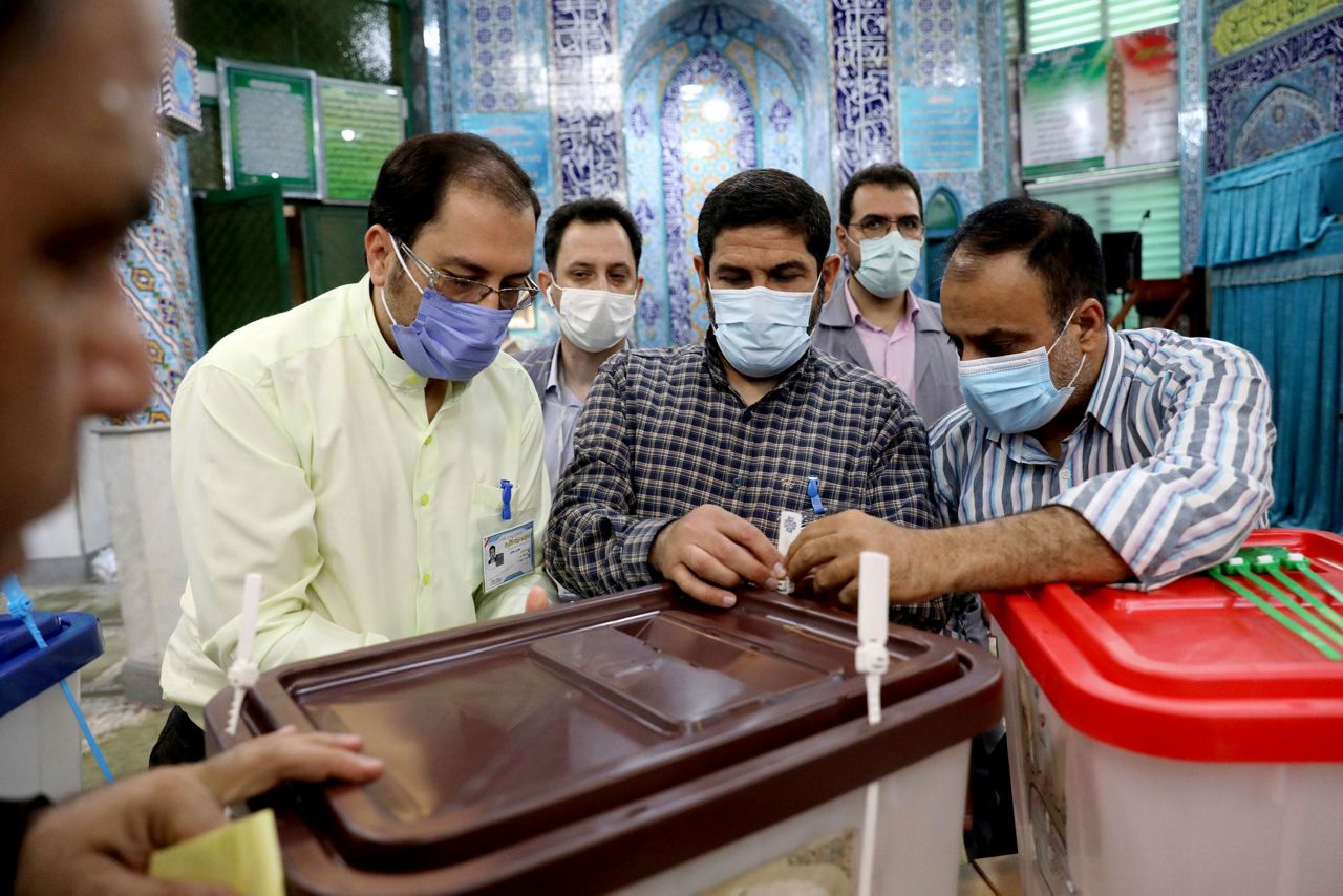 Iran votes in presidential poll tipped in hard-liner's favor