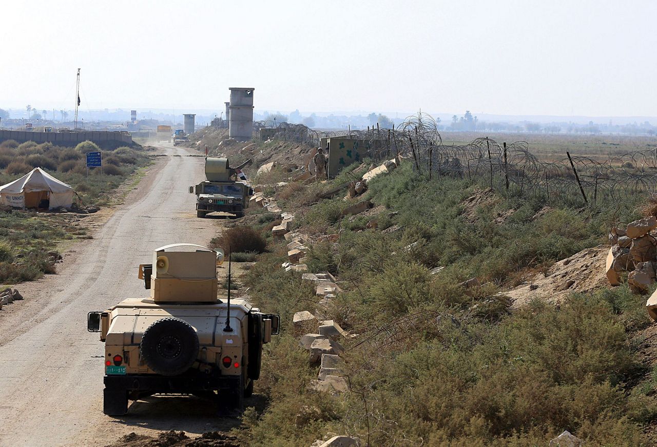 Iraqi town fearful as battle against IS rages next door