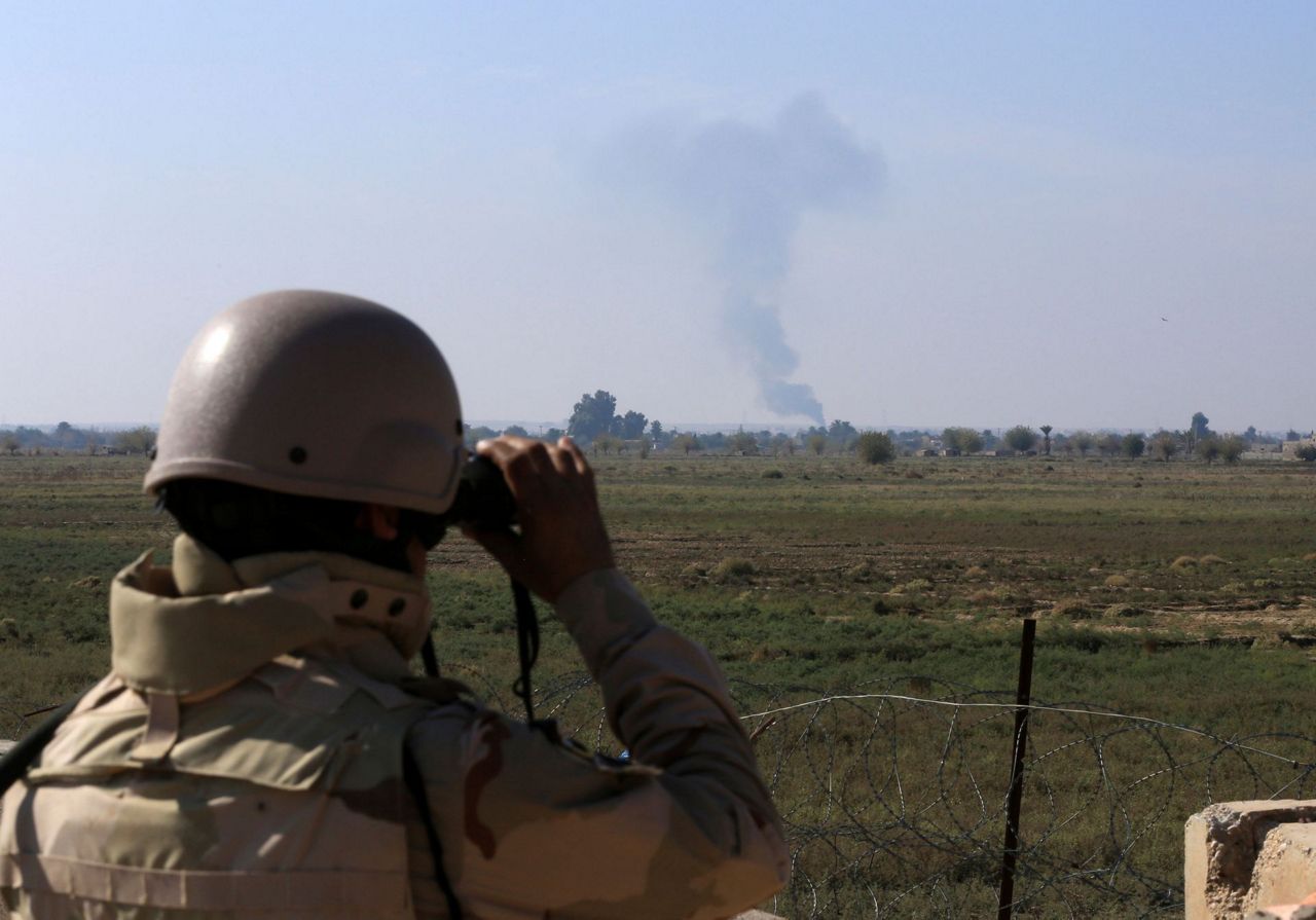 Iraqi town fearful as battle against IS rages next door