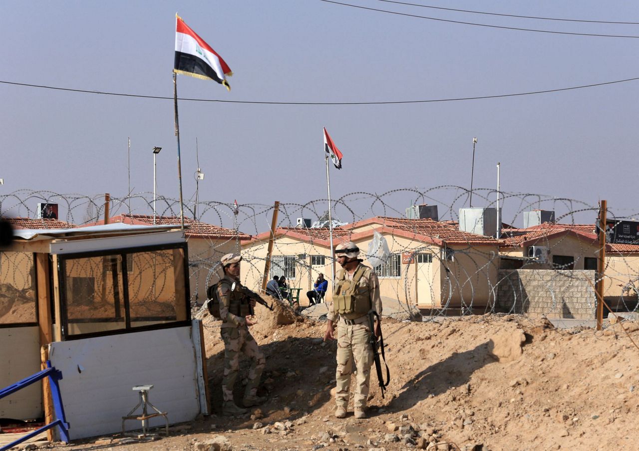 Iraqi town fearful as battle against IS rages next door