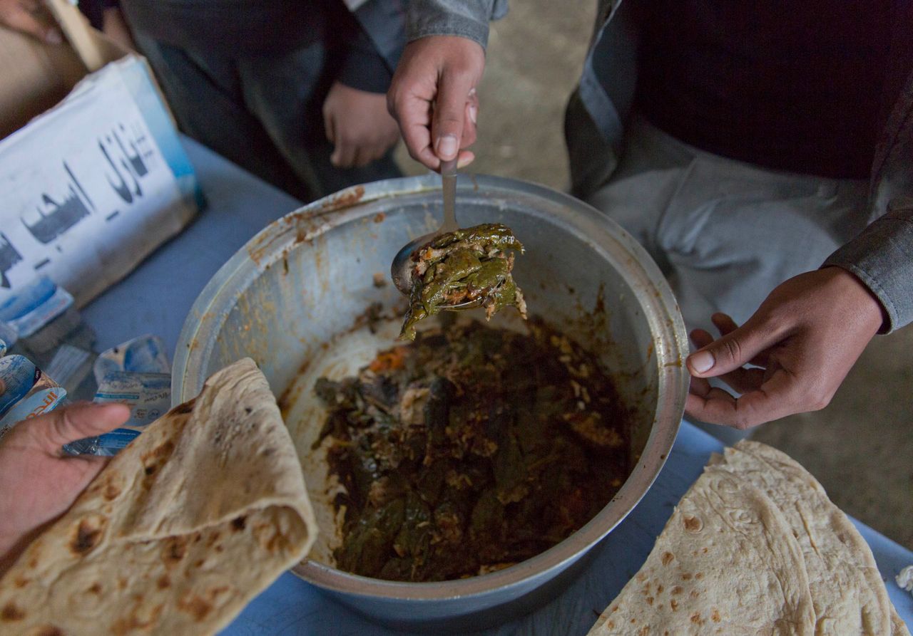 Home-cooked food in Iraqi square brings protesters together