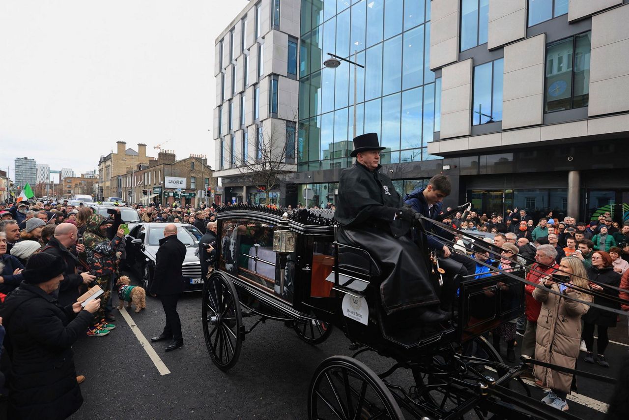 Crowds line Dublin streets for funeral procession of The Pogues singer ...