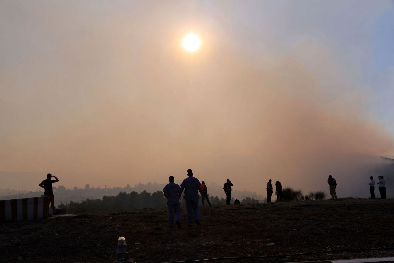 Israeli firefighters work to contain blaze outside Jerusalem