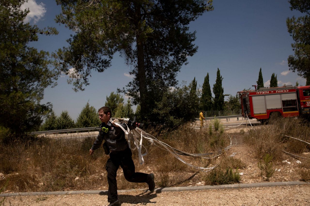 Israeli firefighters work to contain blaze outside Jerusalem