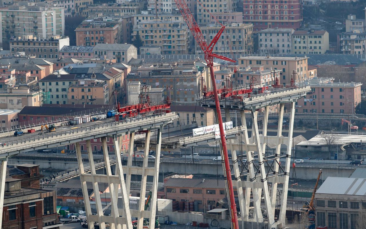 Workers carefully remove remains of collapsed Genoa bridge