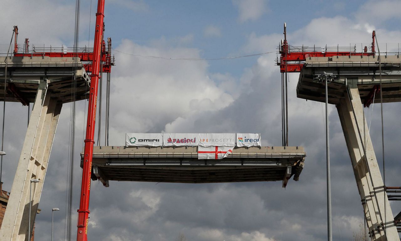 Workers carefully remove remains of collapsed Genoa bridge