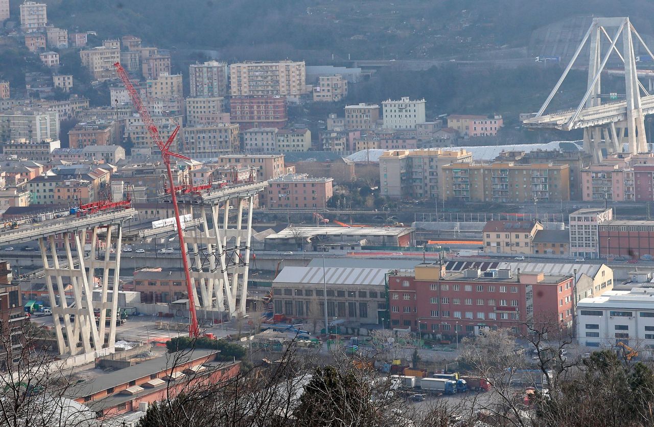Workers carefully remove remains of collapsed Genoa bridge