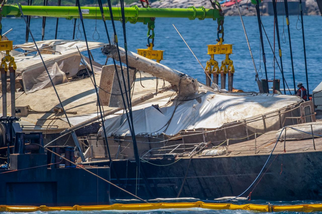 Sunken Bayesian superyacht lifted out of the water off Sicily as ...