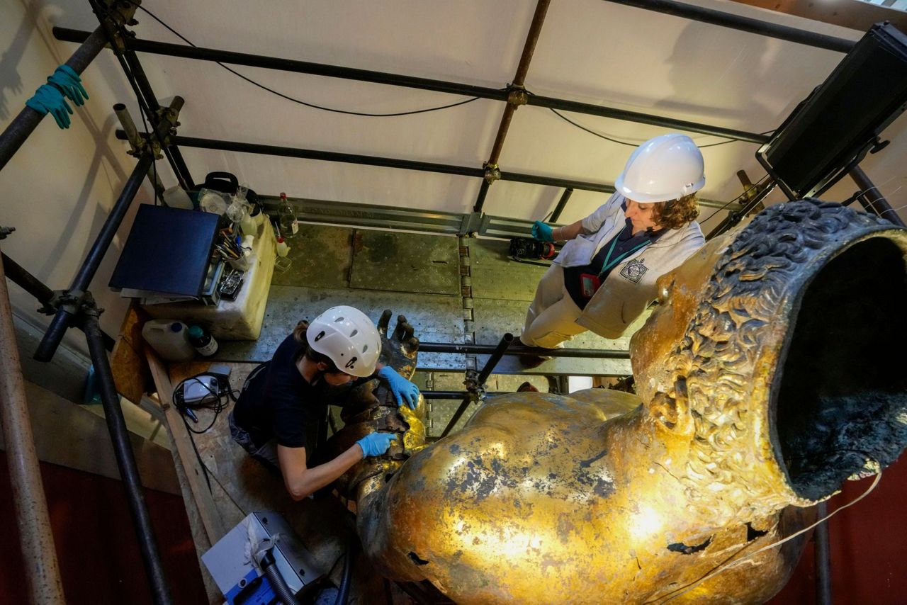 Vatican experts uncovering gilded glory of Hercules statue struck by ...