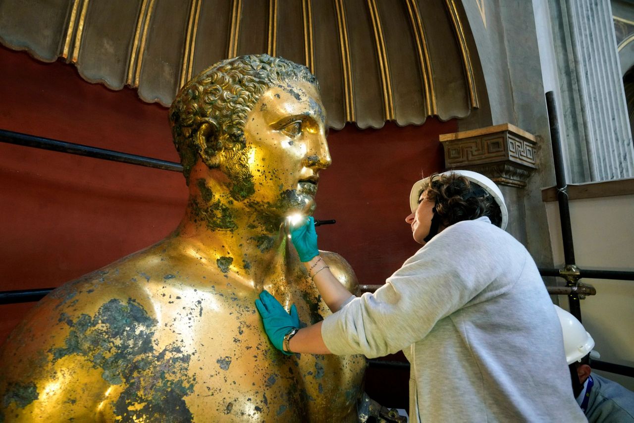 Vatican experts uncovering gilded glory of Hercules statue struck by ...