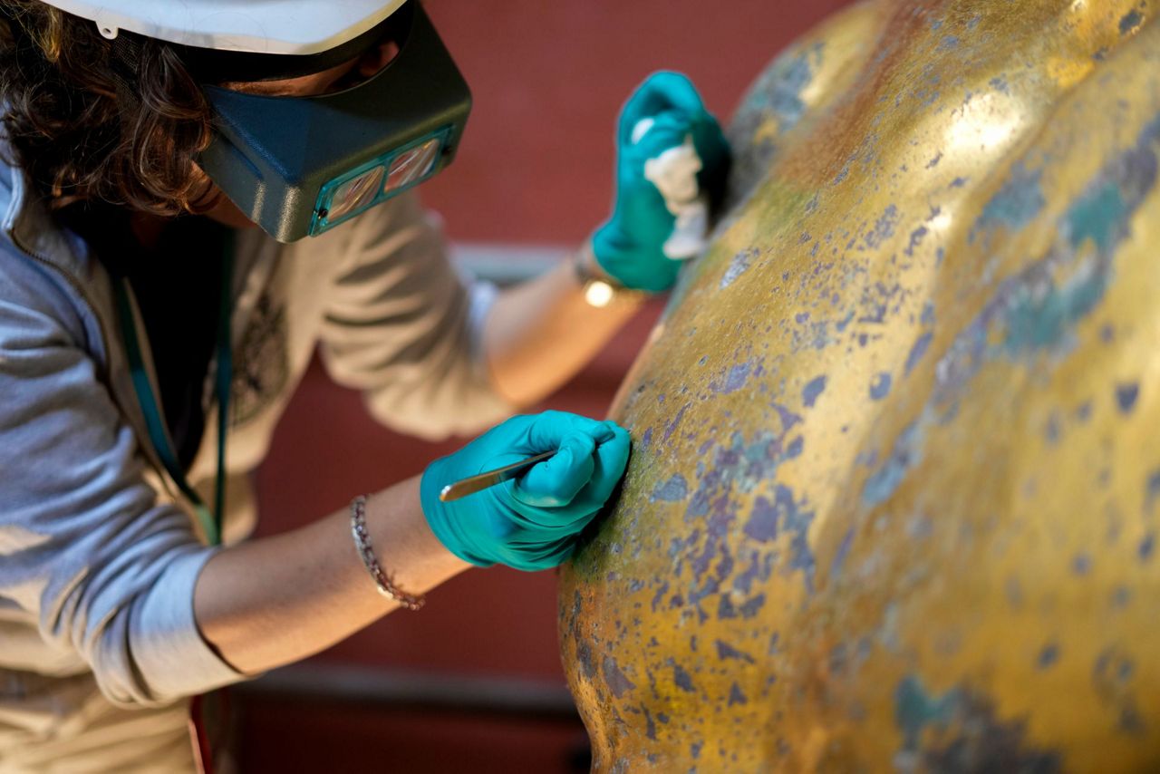 Vatican experts uncovering gilded glory of Hercules statue struck by ...