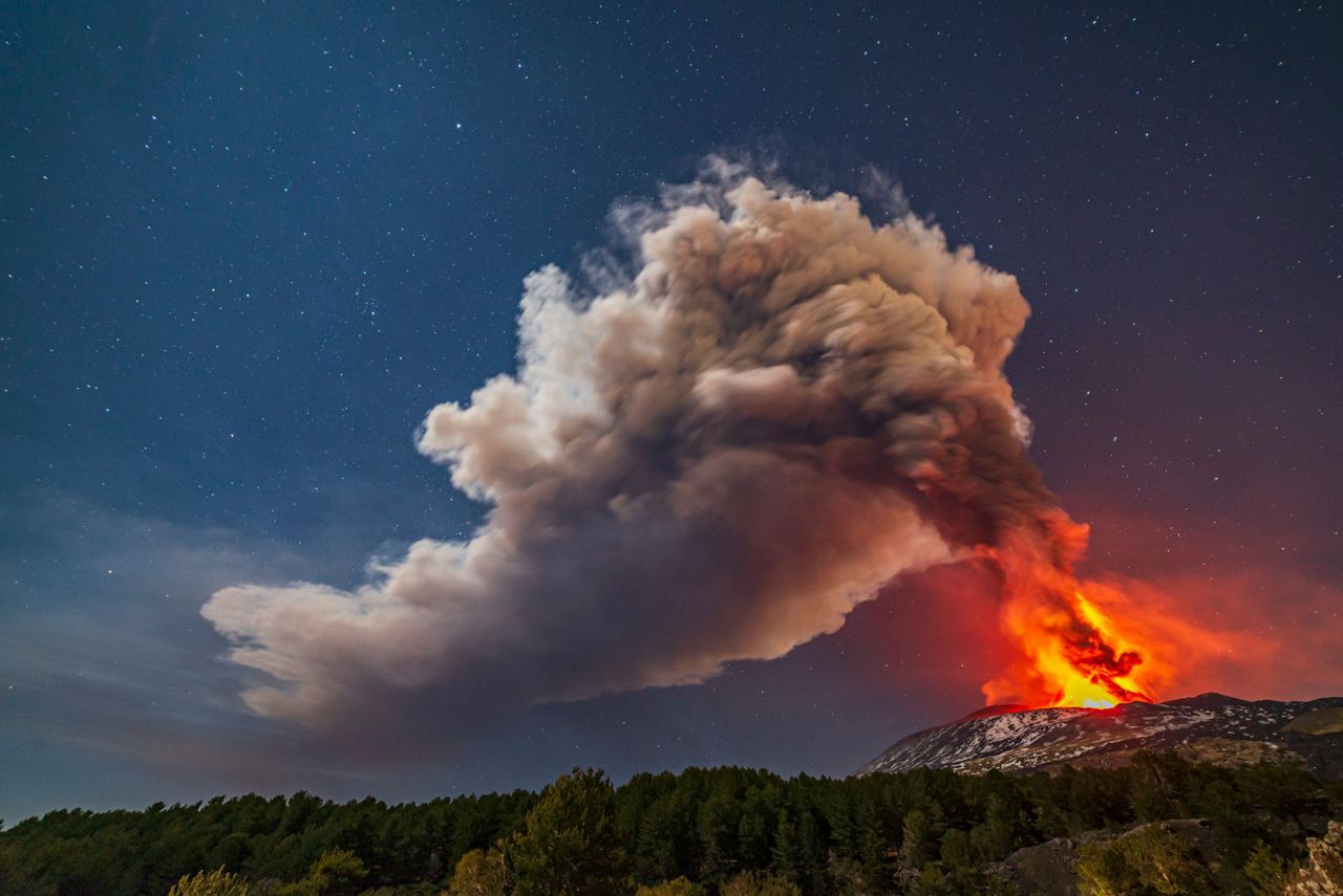 Volcanic lightning streaks sky over fiery Mount Etna