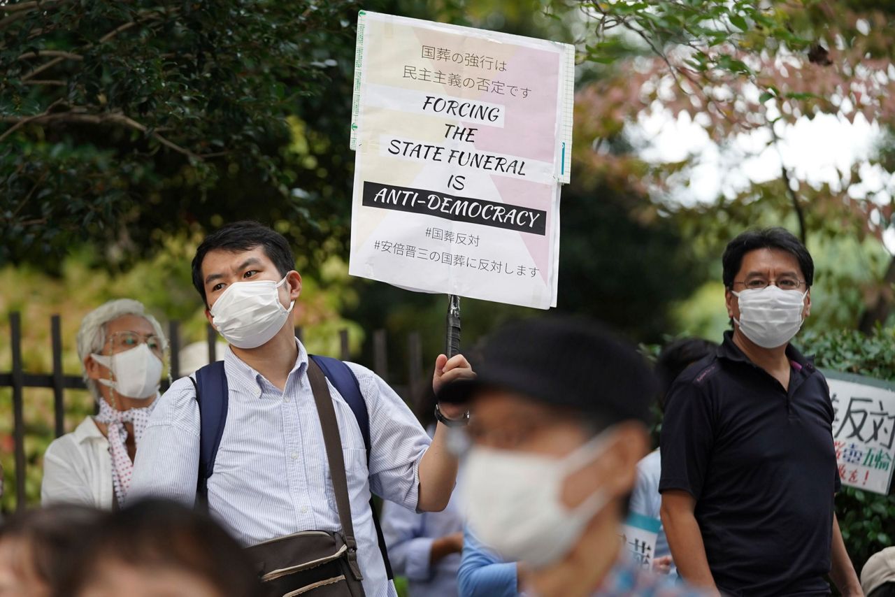 Abe's militaristic funeral captures Japan's tense mood