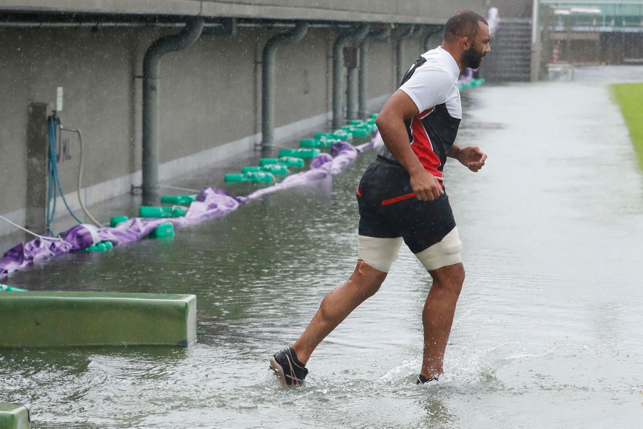As Japan braces for typhoon, rugby squad trains in the rain
