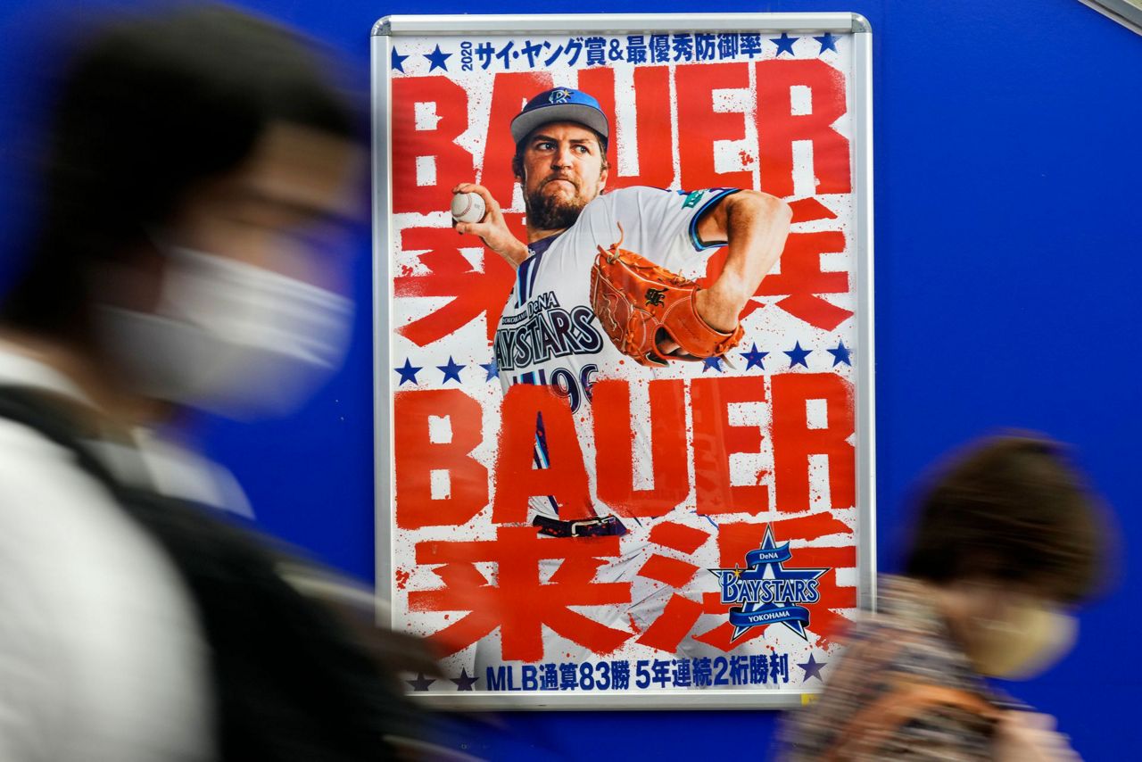 Unsigned in major leagues, Bauer gets big welcome in Japan