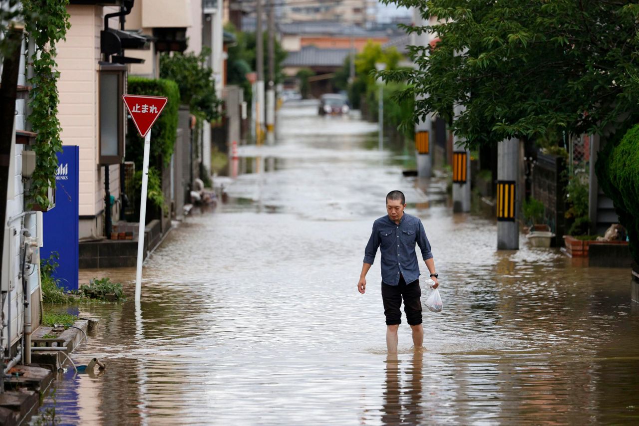 Japan battered by more heavy rain, floods, nearly 60 dead