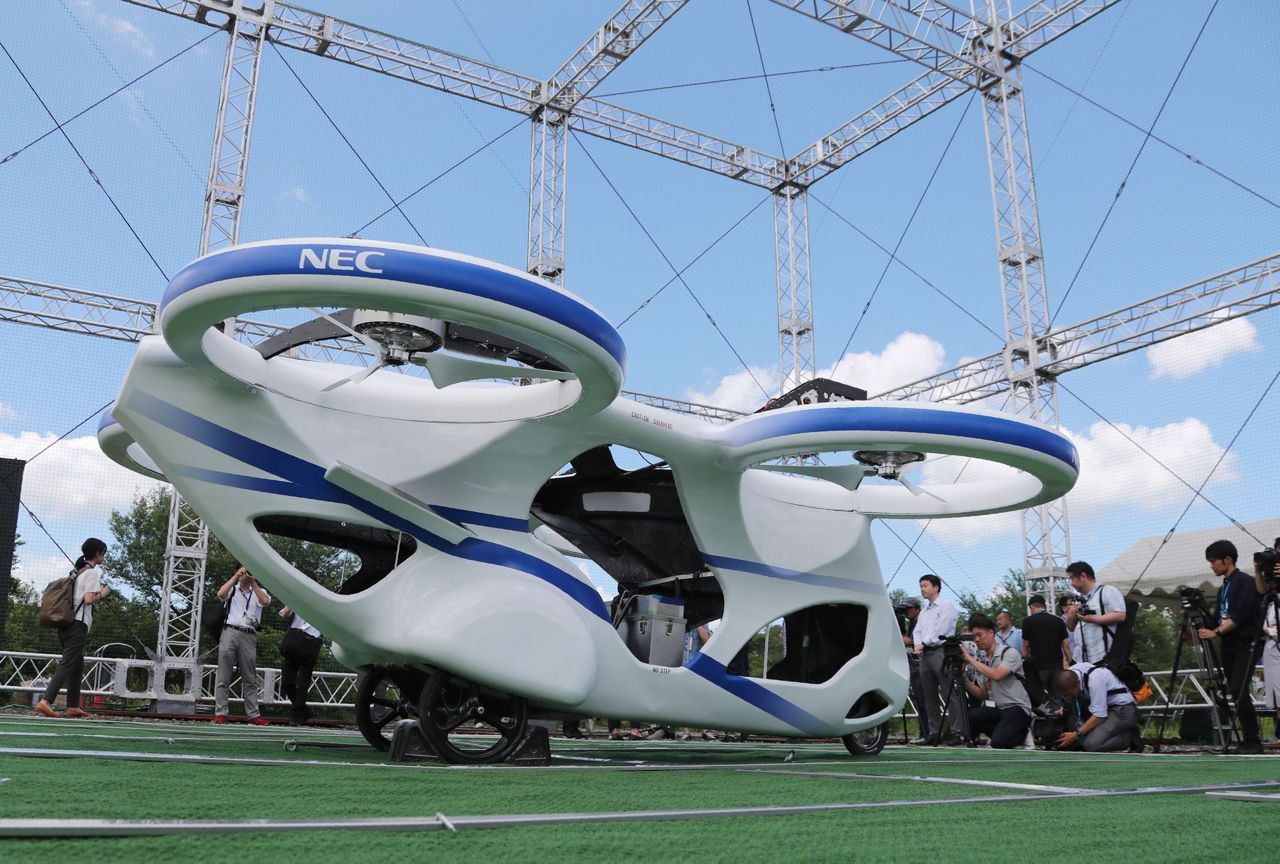 Japan's NEC shows 'flying car' hovering steadily for minute