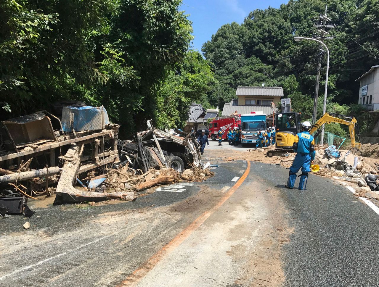 Rescuers look through mud for Japan flood victims; 122 dead