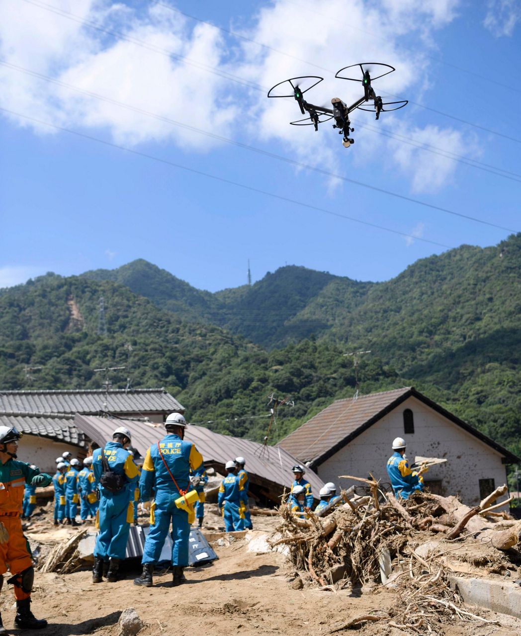 Rescuers look through mud for Japan flood victims; 122 dead