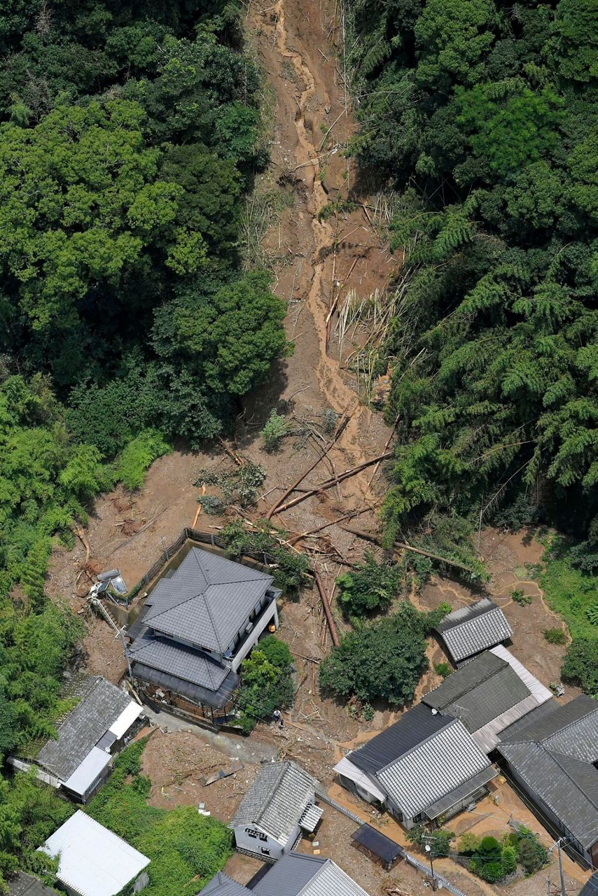 Heavy rain floods southern Japan, leaving over dozen missing