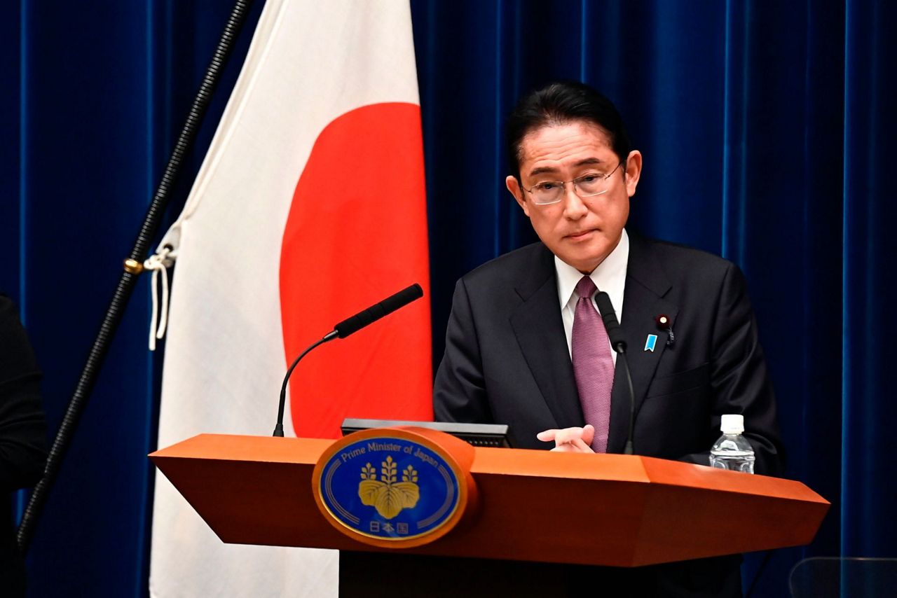 As regional threats rise, Japan eases defense-only strategy