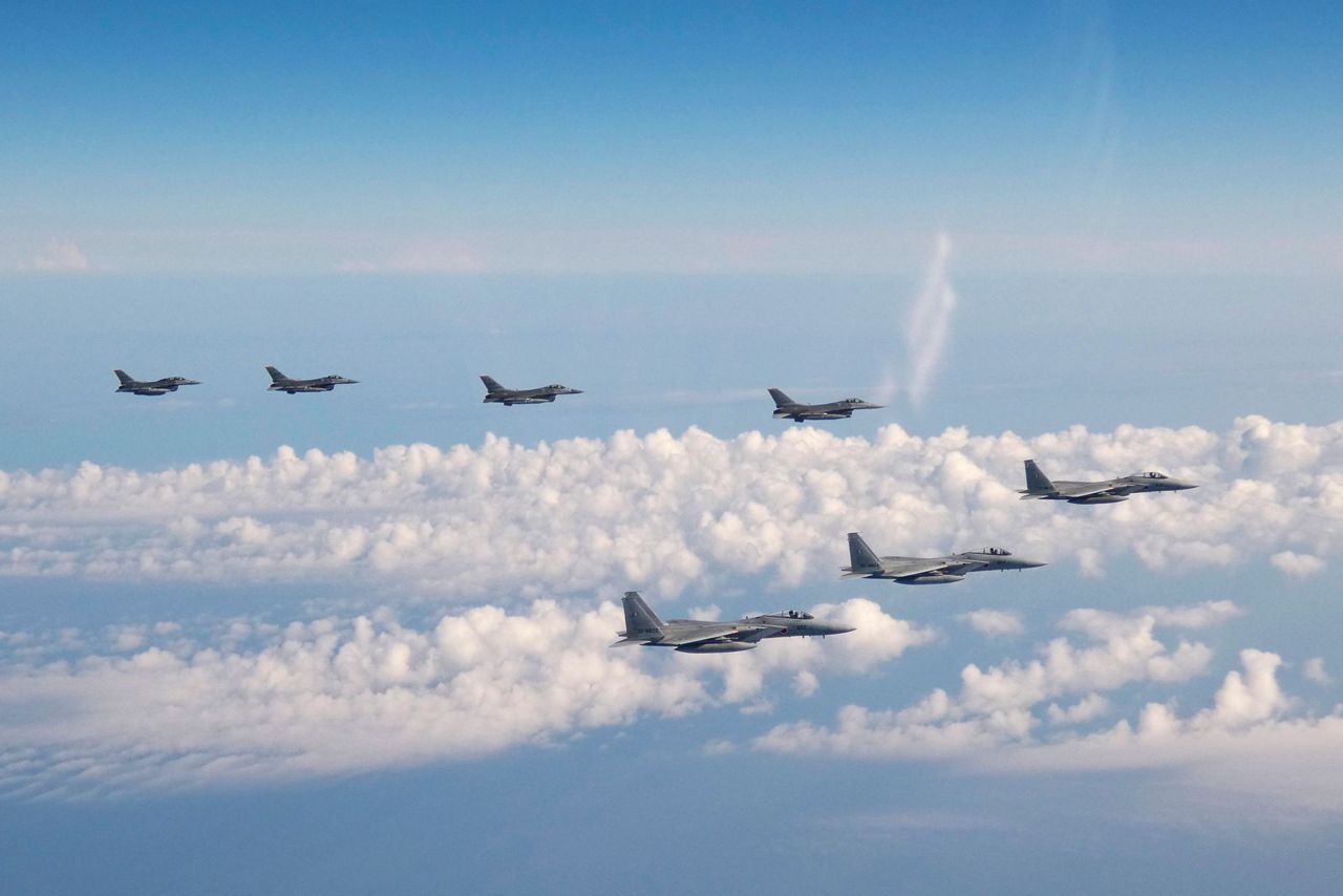 As regional threats rise, Japan eases defense-only strategy