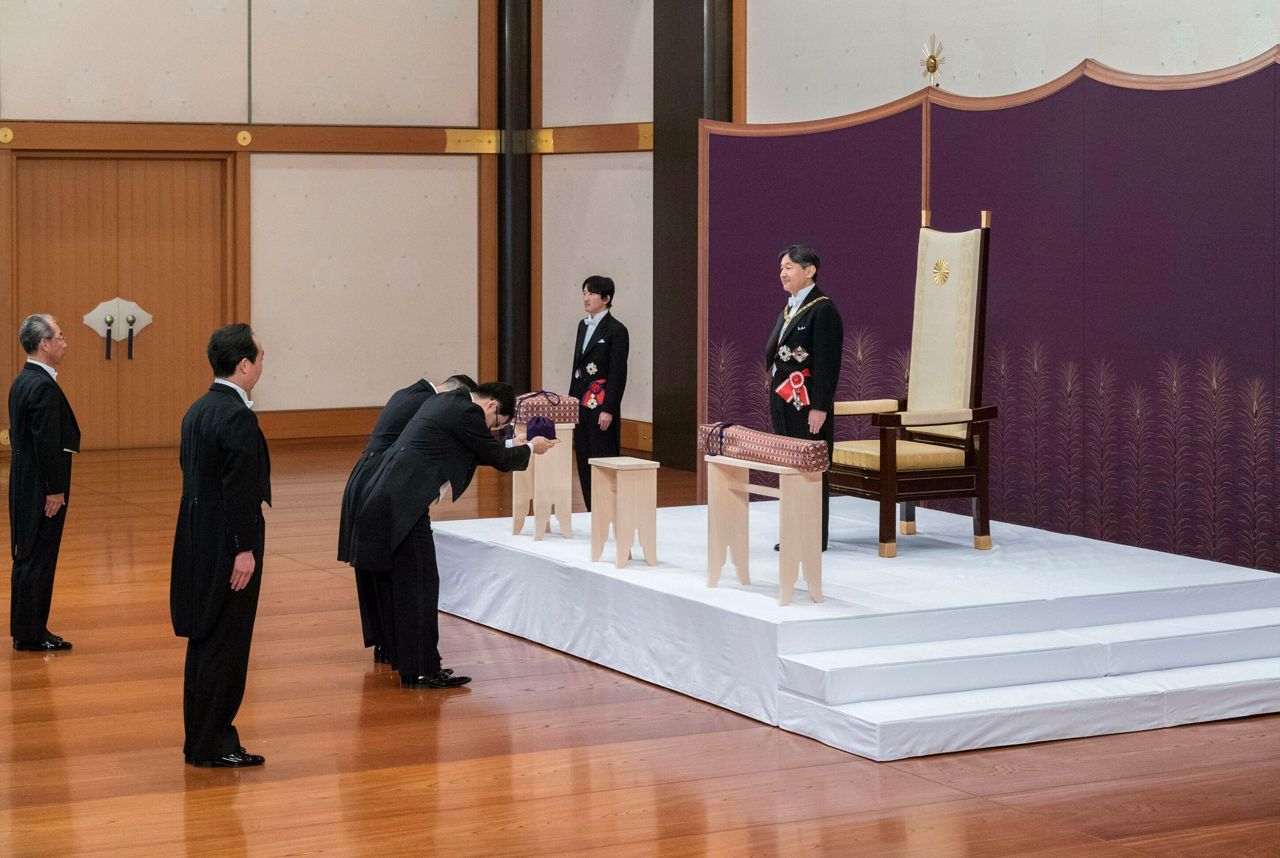Emperor Naruhito takes throne day after his father abdicates