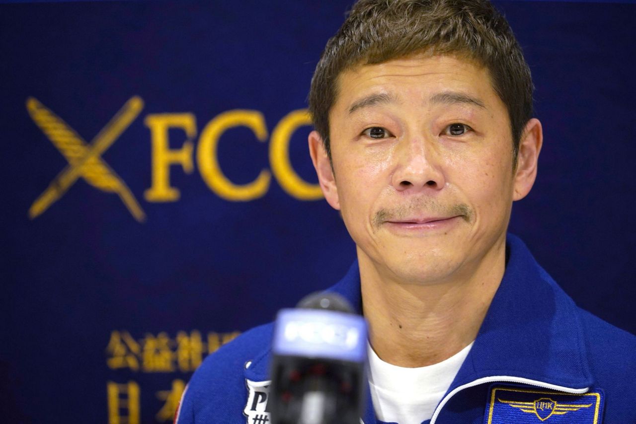 Japan tycoon Maezawa returns from space with business dreams