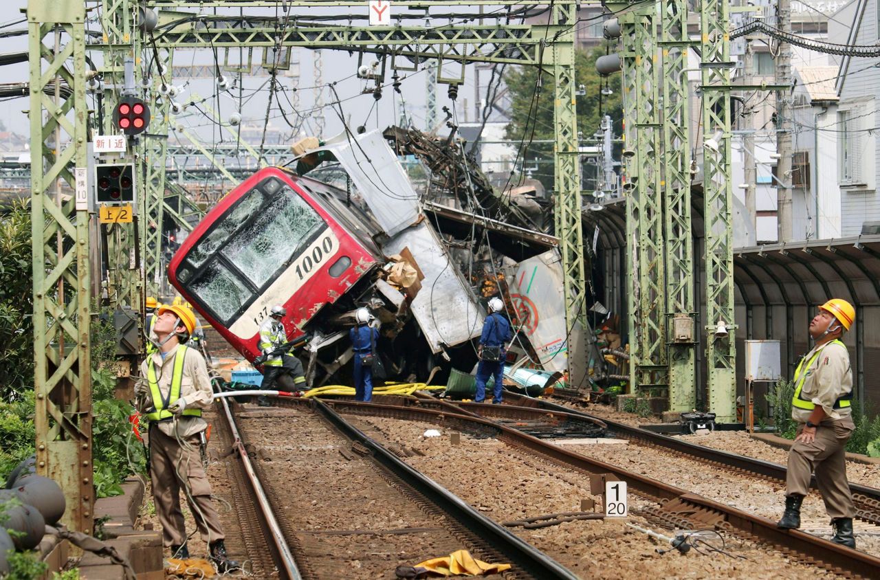 Truck, train collide at rail crossing near Tokyo, 30 injured
