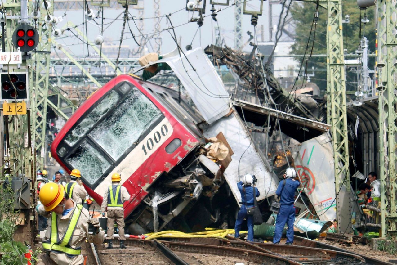 Truck, train collide at rail crossing near Tokyo, 30 injured