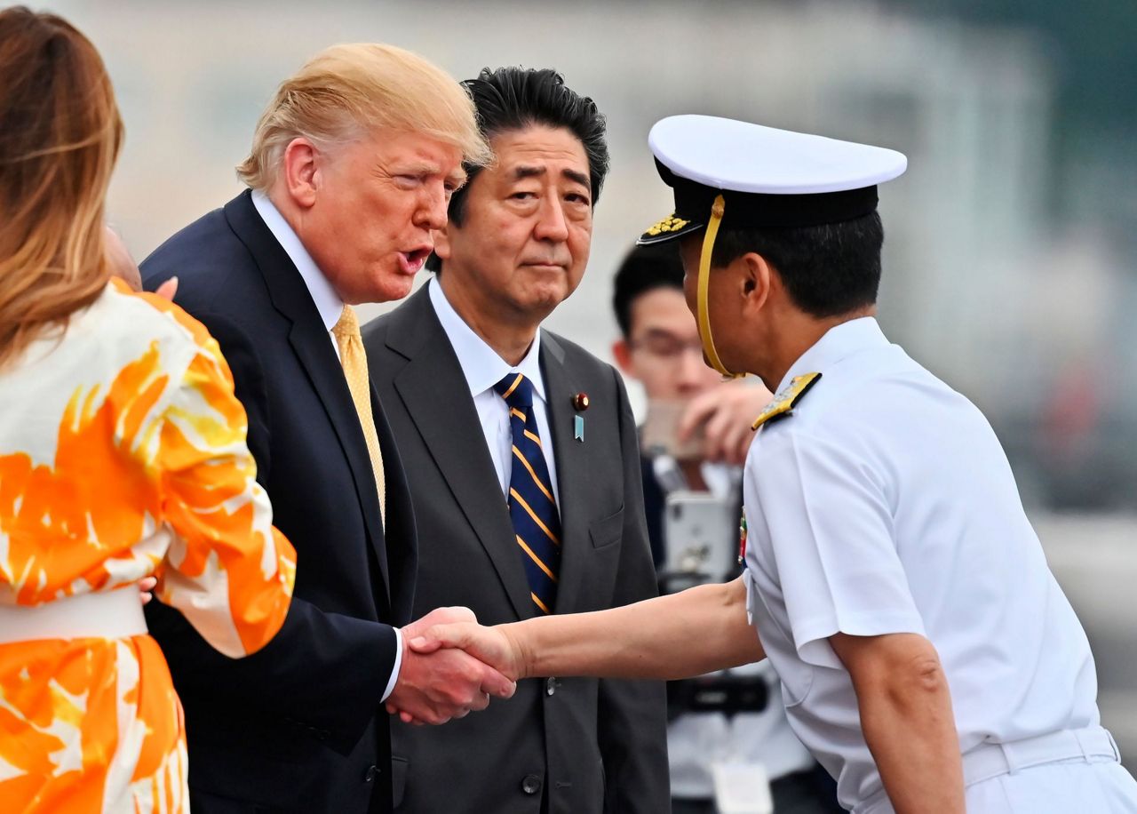 The Latest: Trump visits Japanese troops aboard destroyer