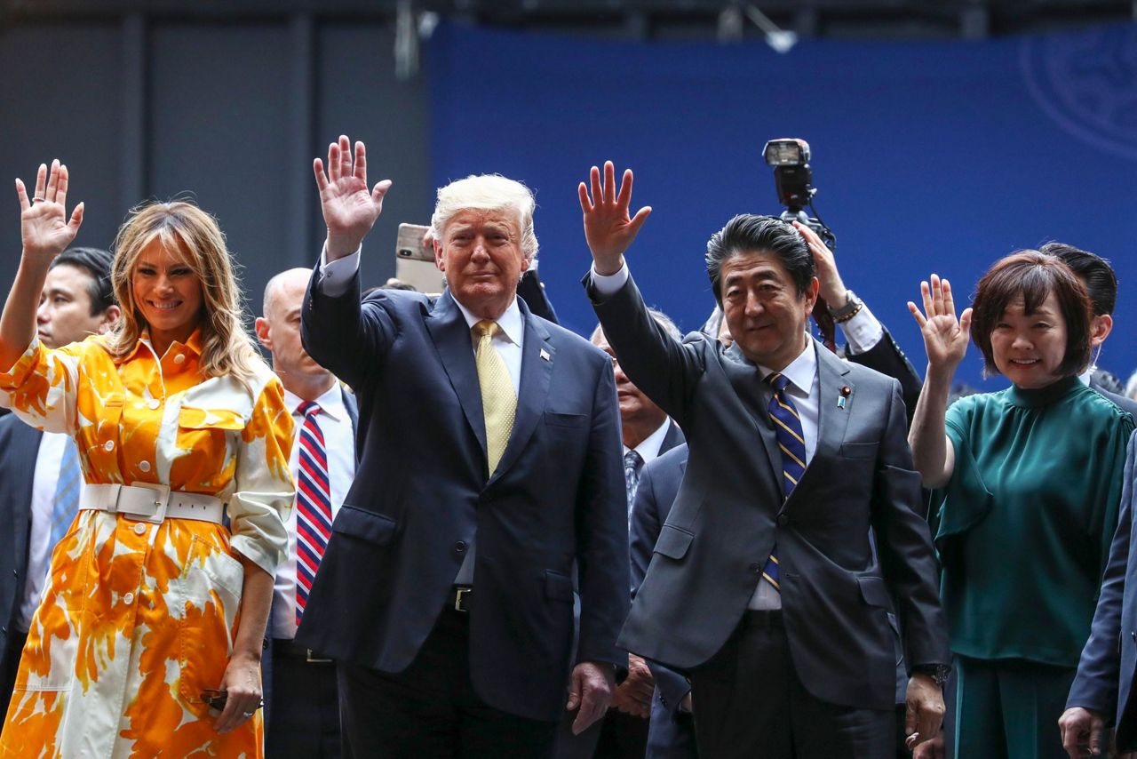 The Latest: Trump visits Japanese troops aboard destroyer